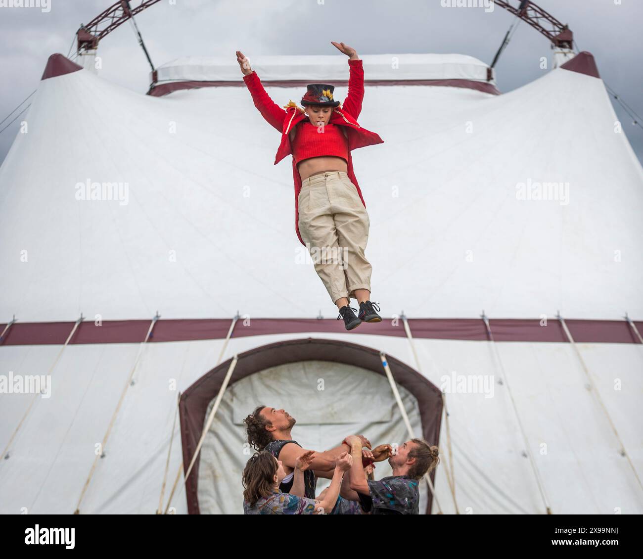 London, UK. 30 May 2024. Acrobats perform outside the big top at a ...
