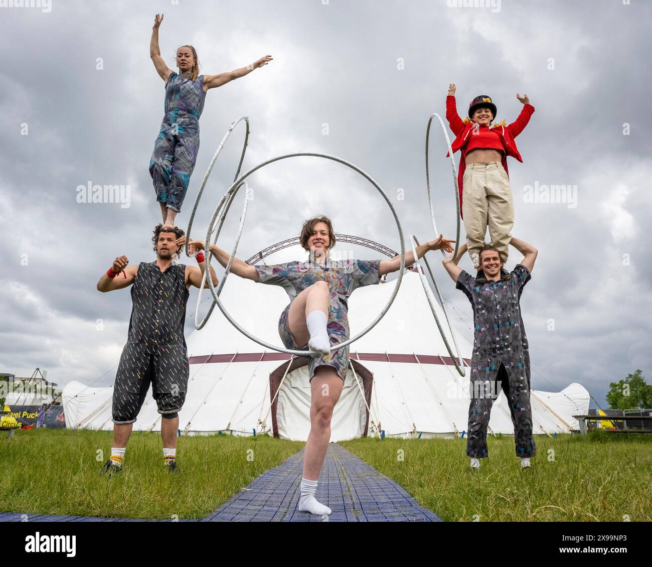 London, UK. 30 May 2024. Acrobats perform outside the big top at a ...