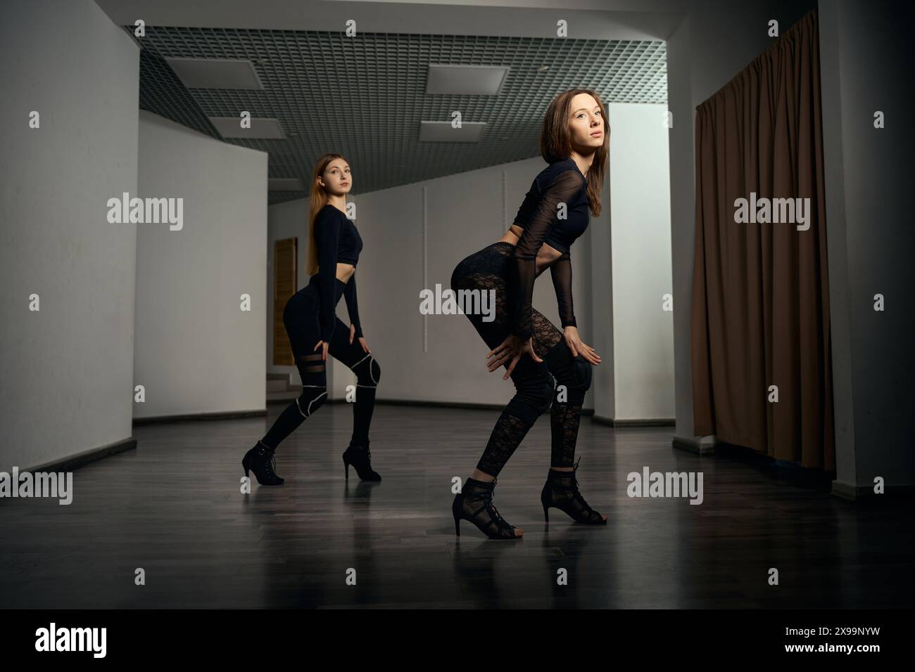 Two young ladies dancing in high heels Stock Photo - Alamy