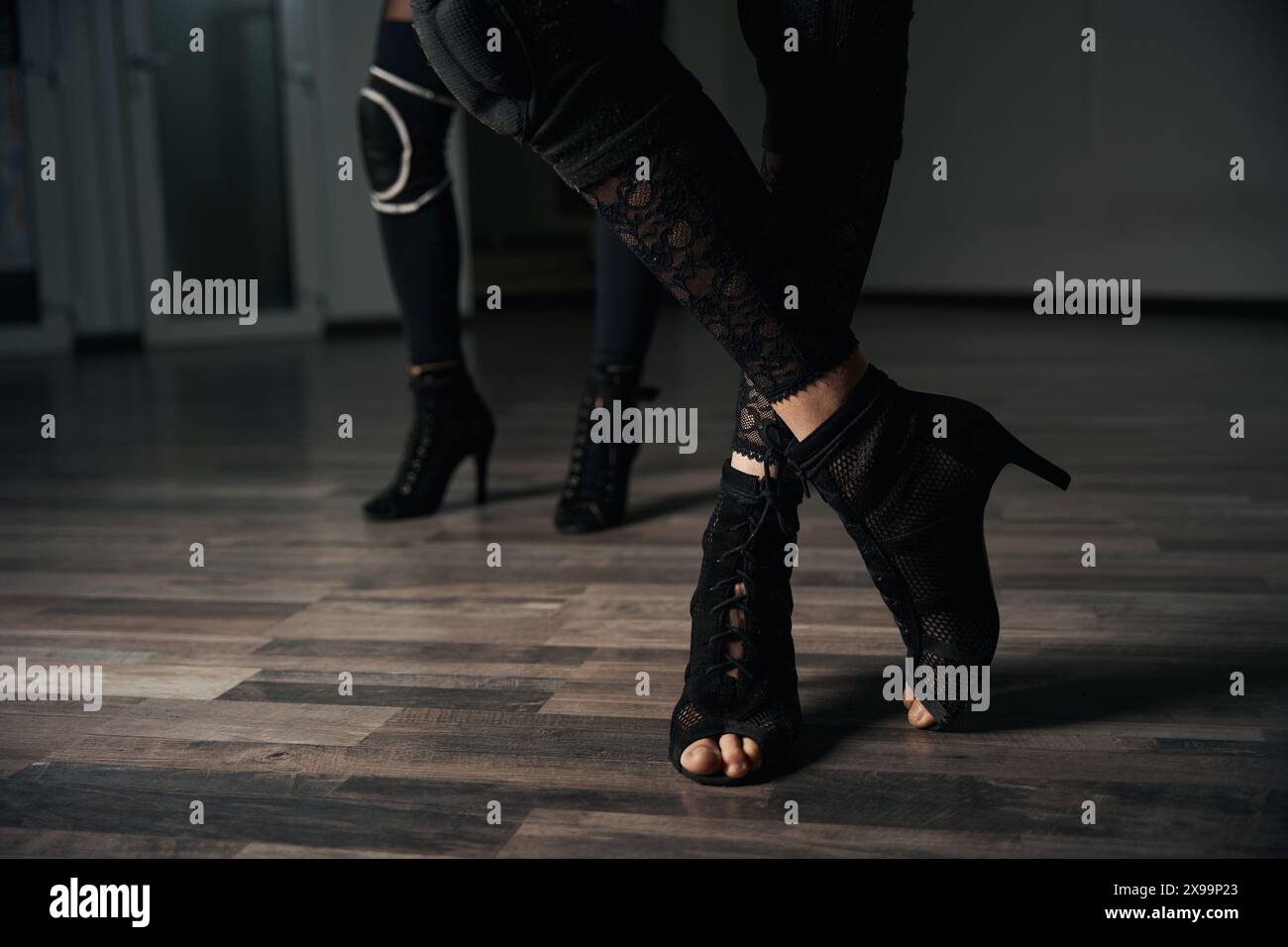 Duet of dancers striking pose for stiletto dance Stock Photo - Alamy