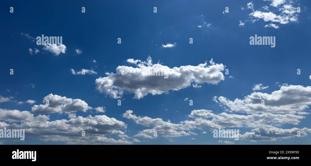 Fluffy cumulus clouds on blue sky background. Cloudscape white and grey ...