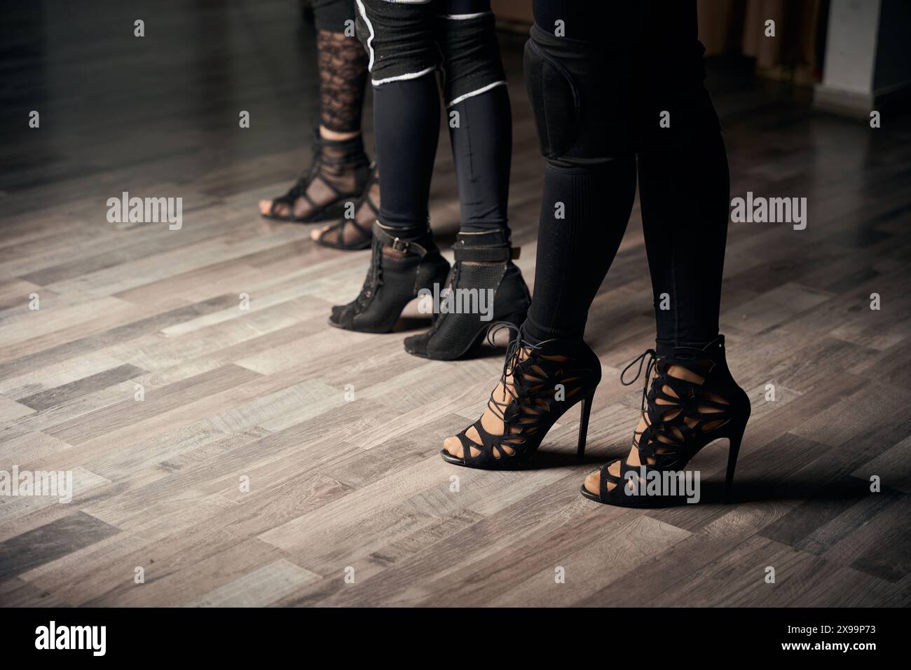 Trio of high heels dancers striking dance pose Stock Photo - Alamy