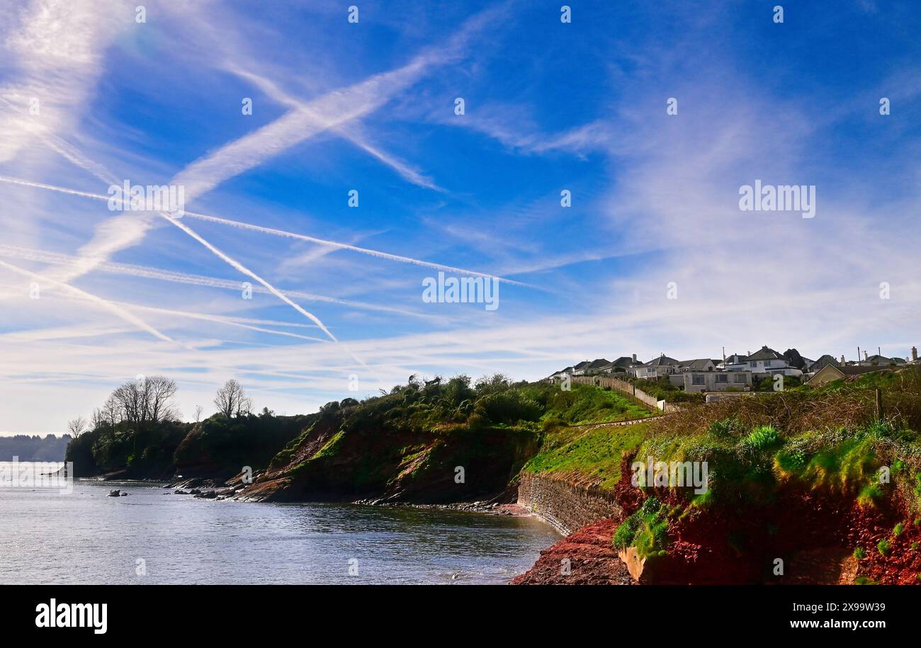 Clouds and aircraft vapour trails (contrails) in blue sky Stock Photo ...