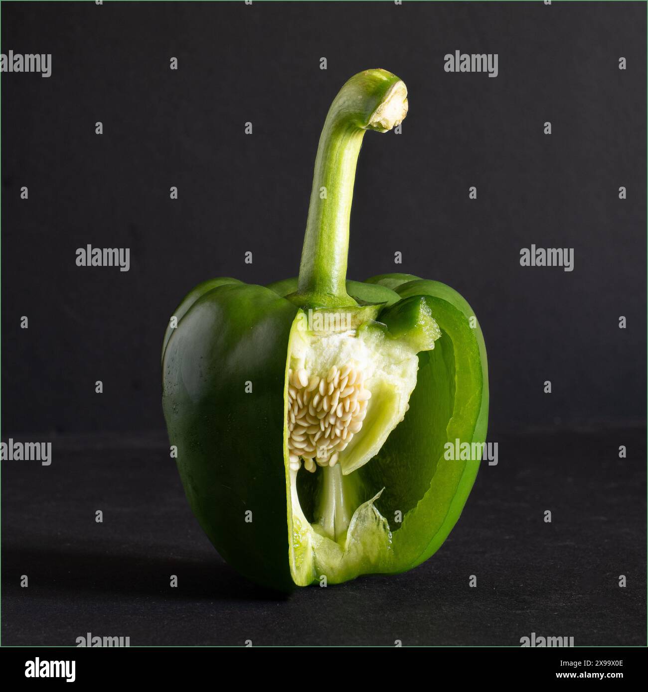 Green bell pepper (Capsicum) cut-away to show the seeds inside Stock ...