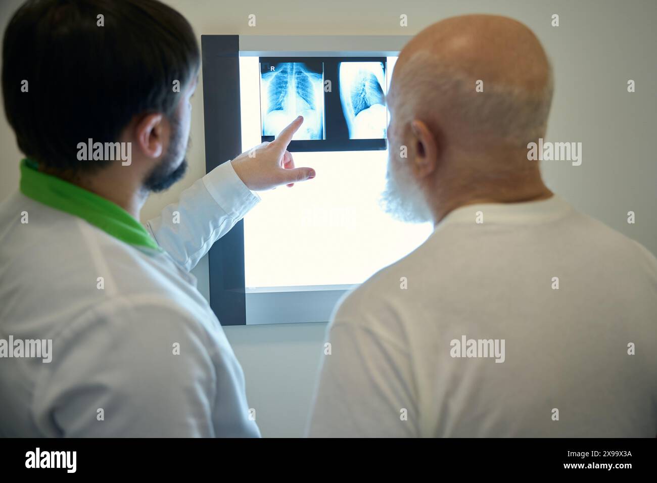 Patient and doctor looking at chest x-ray Stock Photo - Alamy
