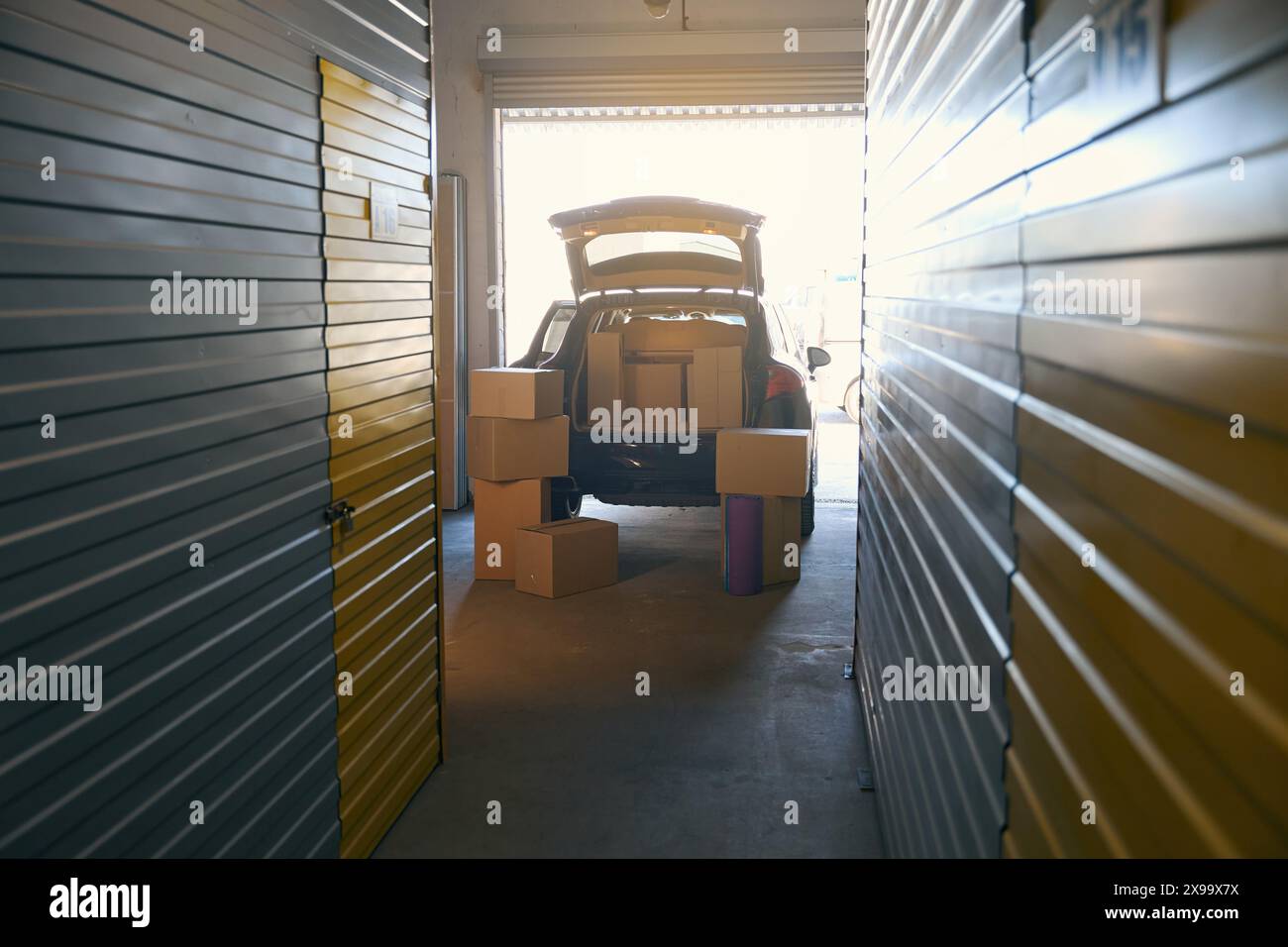 Car with boxes in the trunk is in the storage service Stock Photo - Alamy