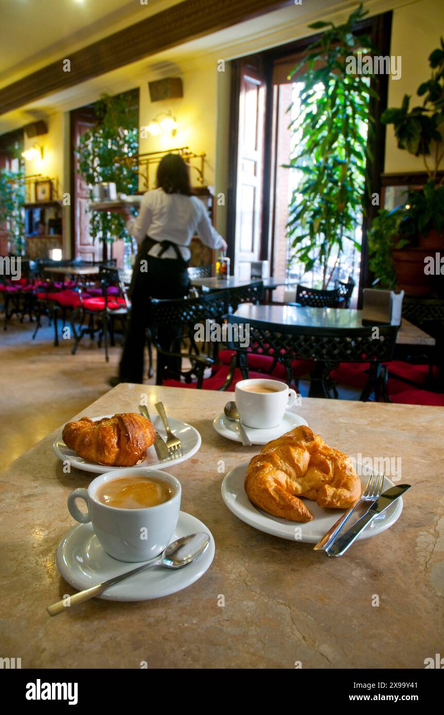 Coffee with croissants for breakfast in a typical cafe. Madrid, Spain ...