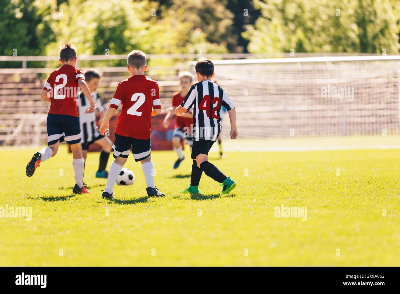 Football Soccer Players Running with Ball. Youth Soccer League For Kids ...