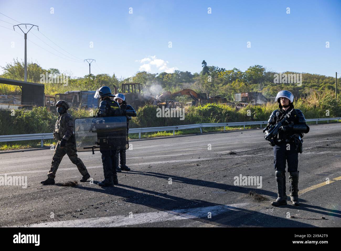 Gendarmes conduct a clearance operation of wreckages obstructing the ...