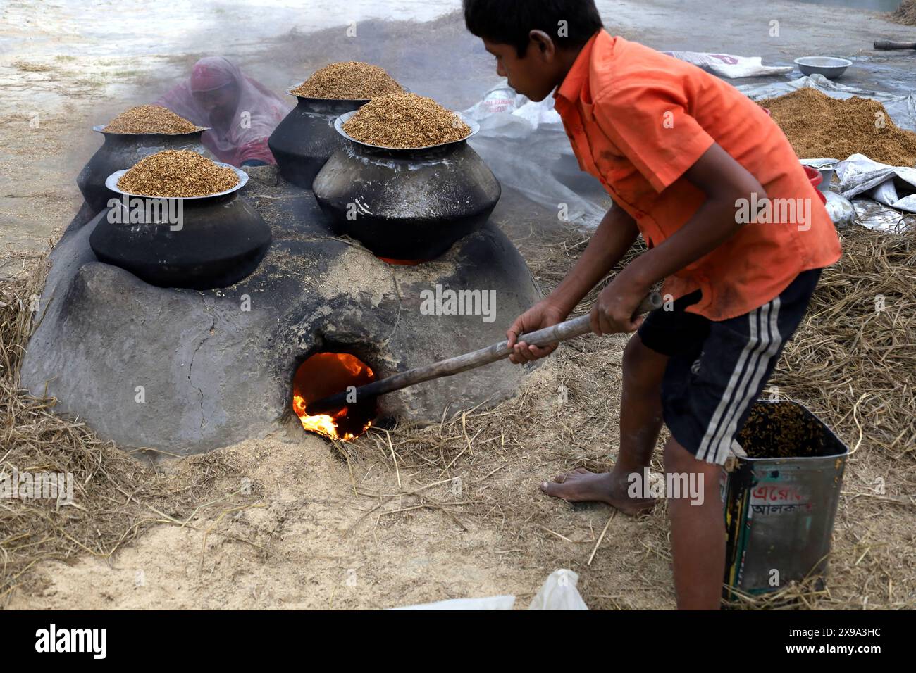 Mithamain, Kishoreganj, Bangladesh. 30th May, 2024. A mother and her ...