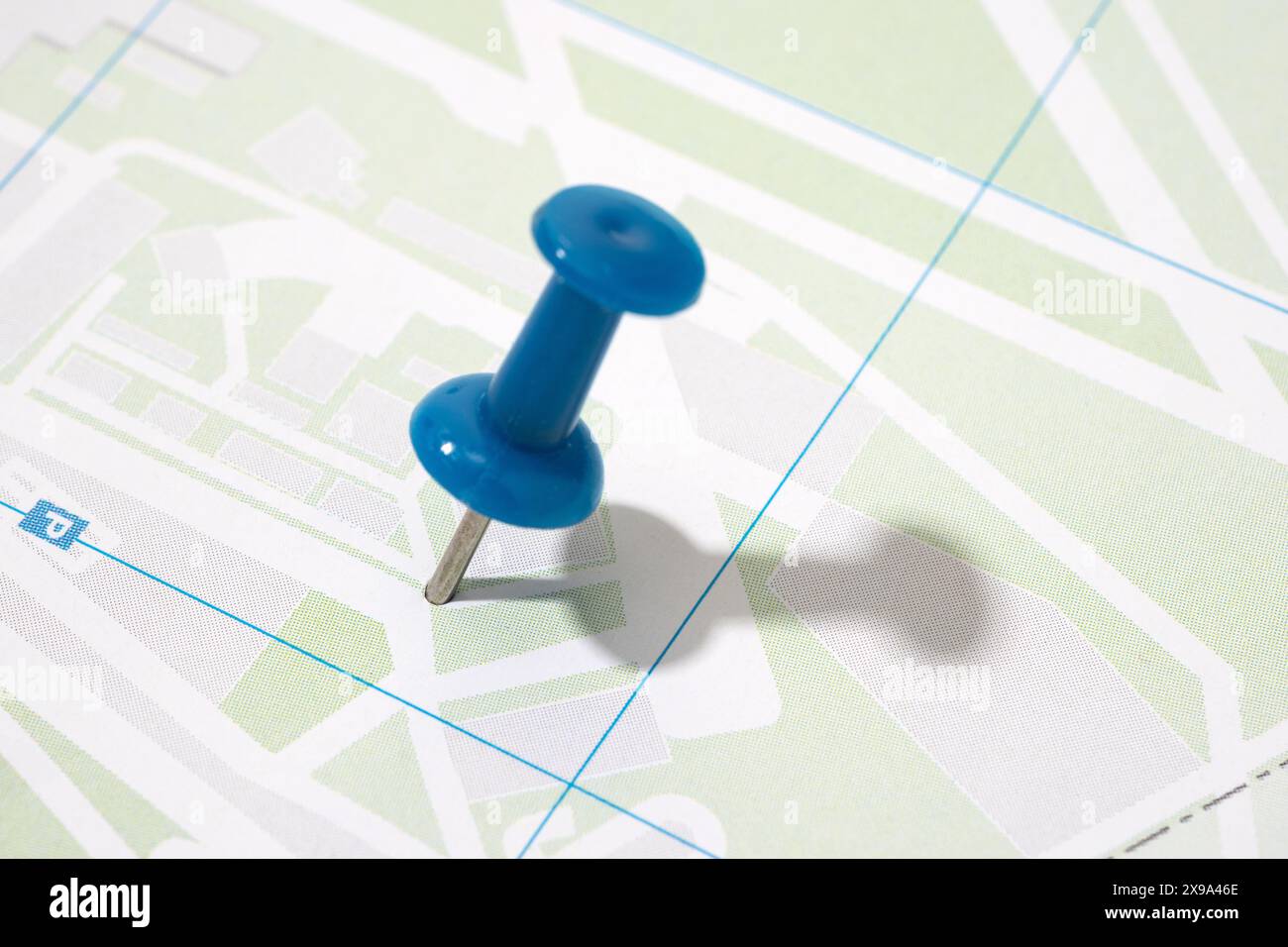 Thumbtack on a paper city map. Map location concept Stock Photo - Alamy