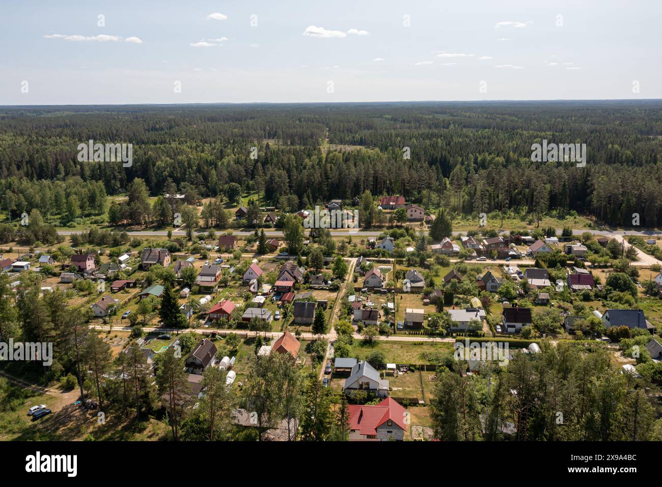 Overhead view of houses and buildings nestled in a forest village ...