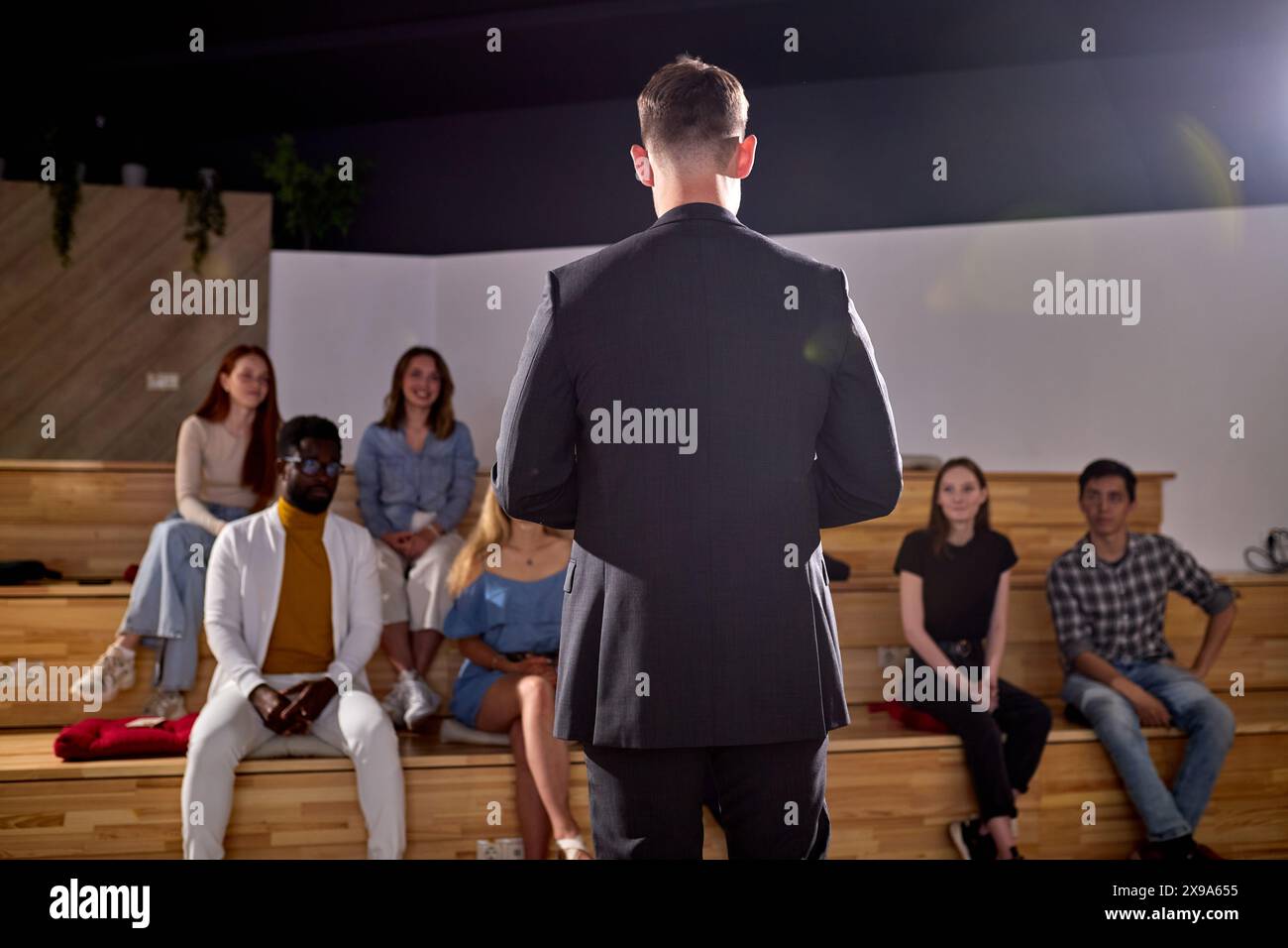 Caucasian Male College Couch Gives Lecture to Classroom Full of Multi ...