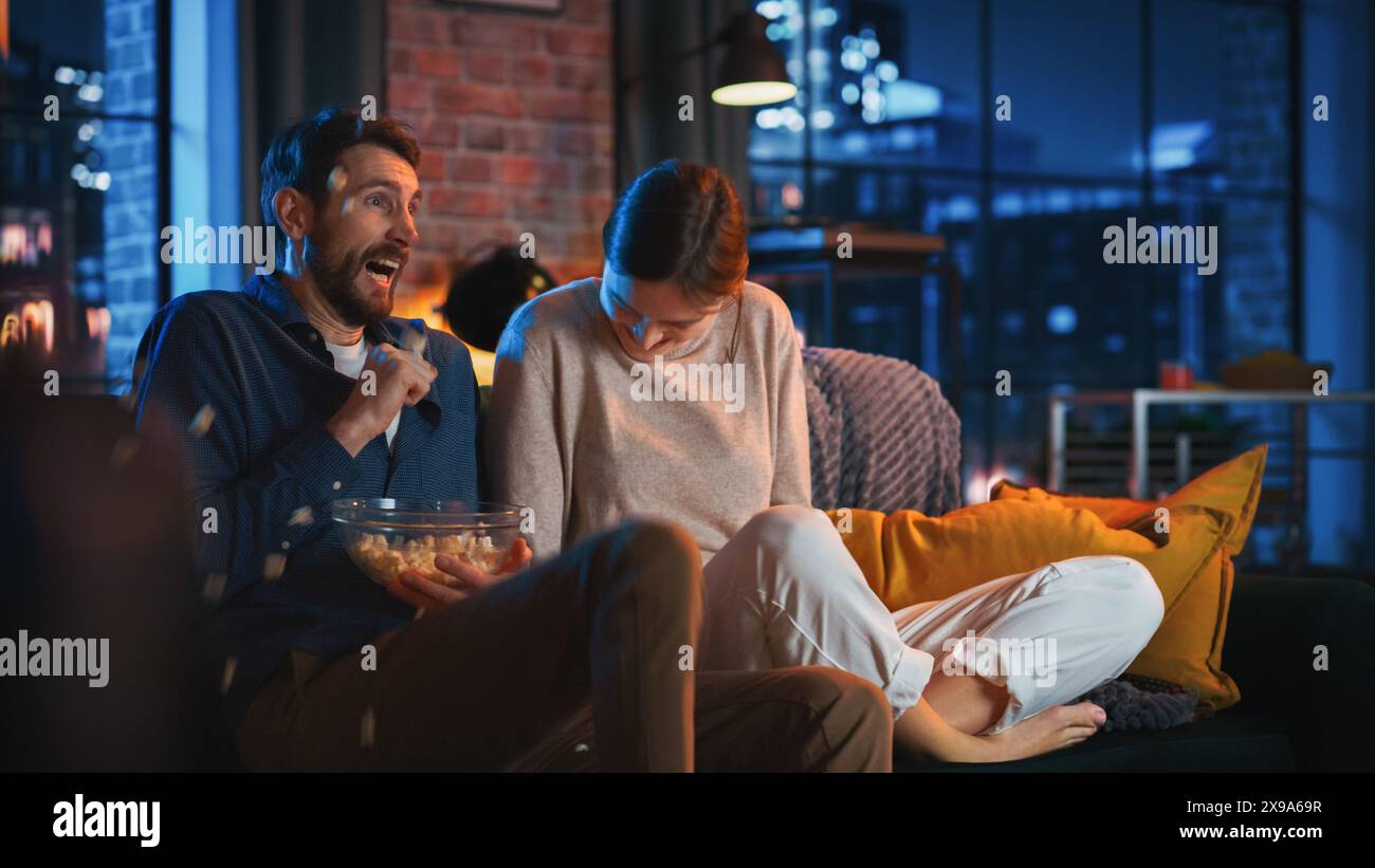 Portrait of Beautiful Couple Spending Time at Home, Sitting on a Couch ...
