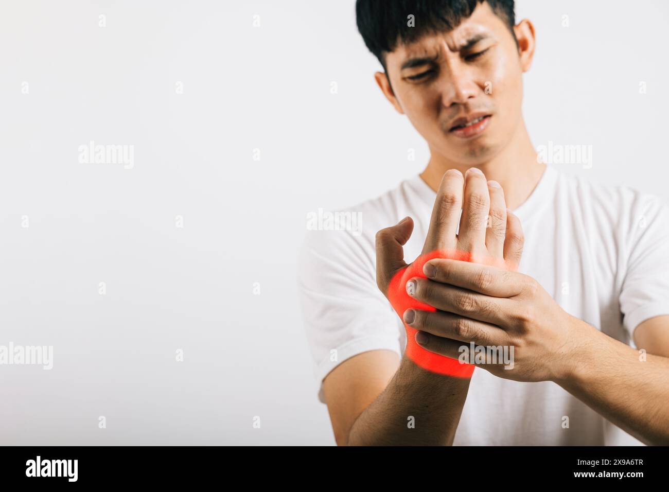 Portrait of an Asian young man suffering from hand and palm pain Stock ...