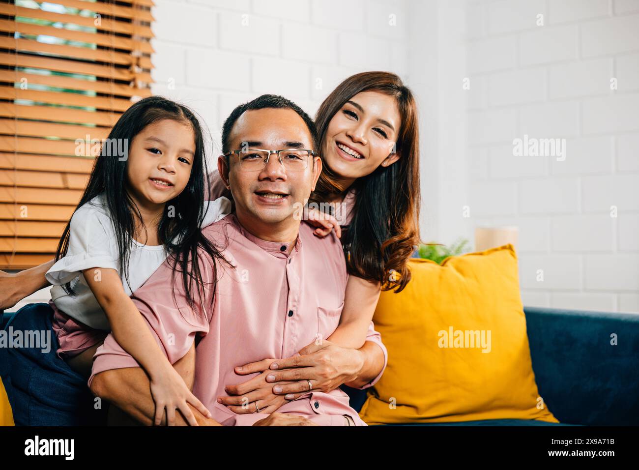 A joyful family in their comfortable modern house enjoys quality time ...