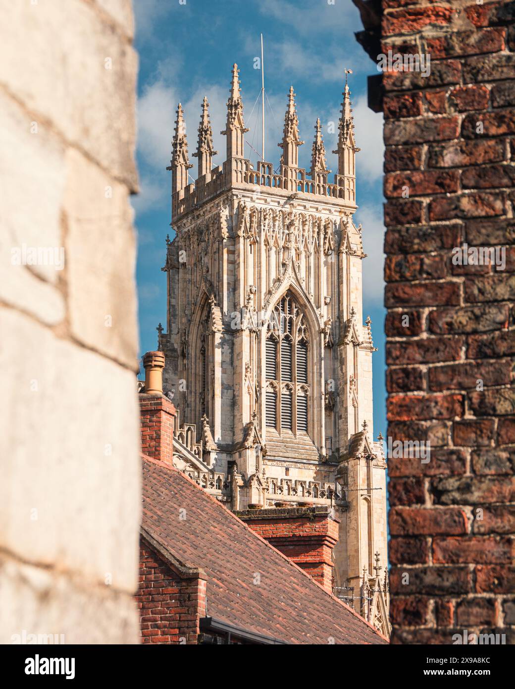 York Minster view between the Bar Walls and Red brick buildings of York ...