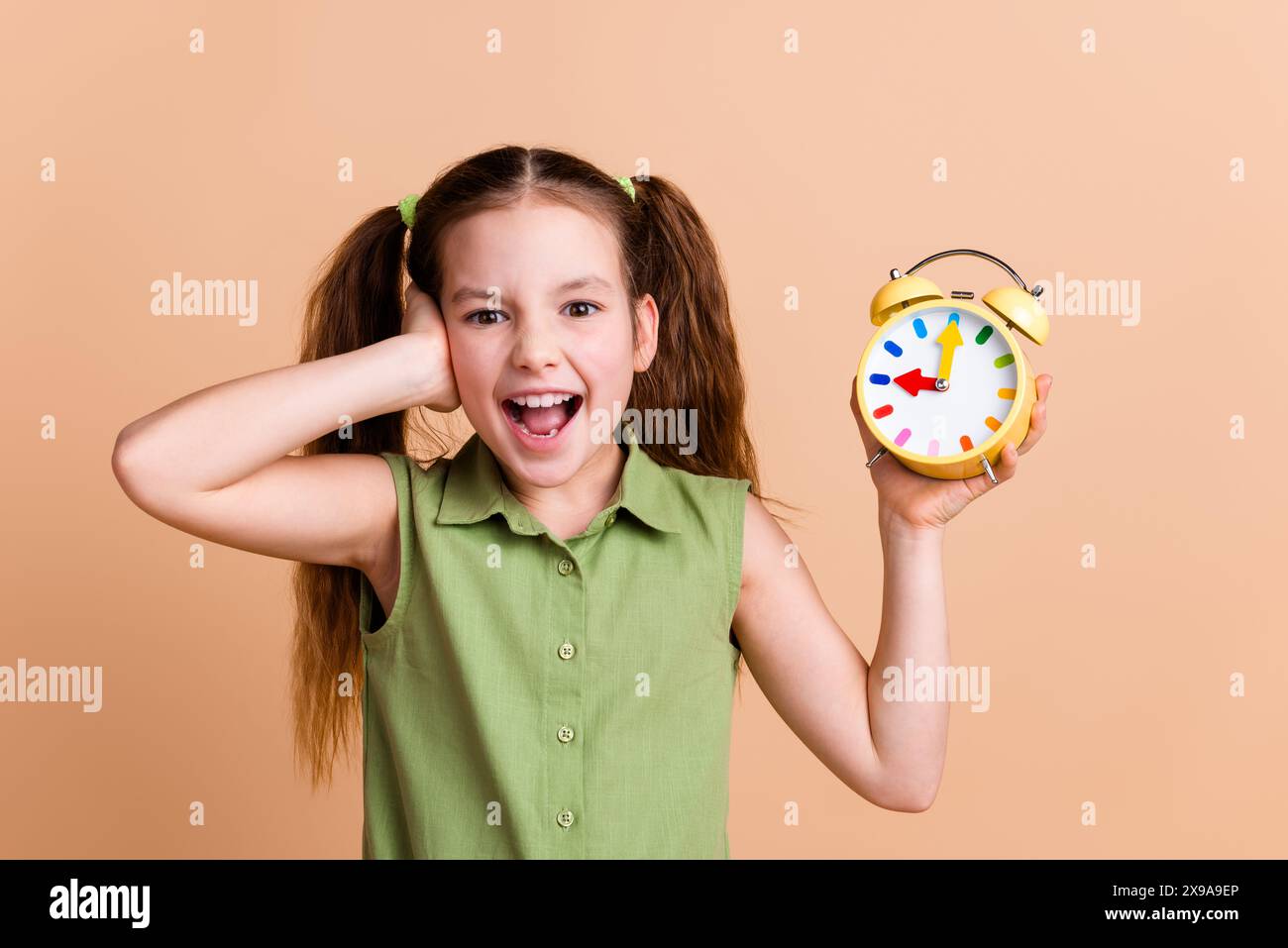 Photo of angry girl suffer loud rin clock bell hide ears isolated pastel color background Stock ...