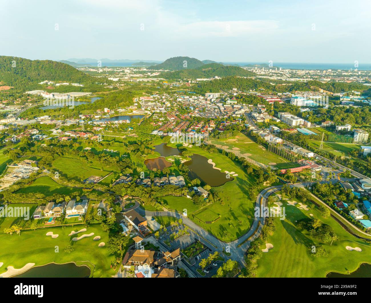 Aerial view of beautiful green golf field fairway and putting green ...
