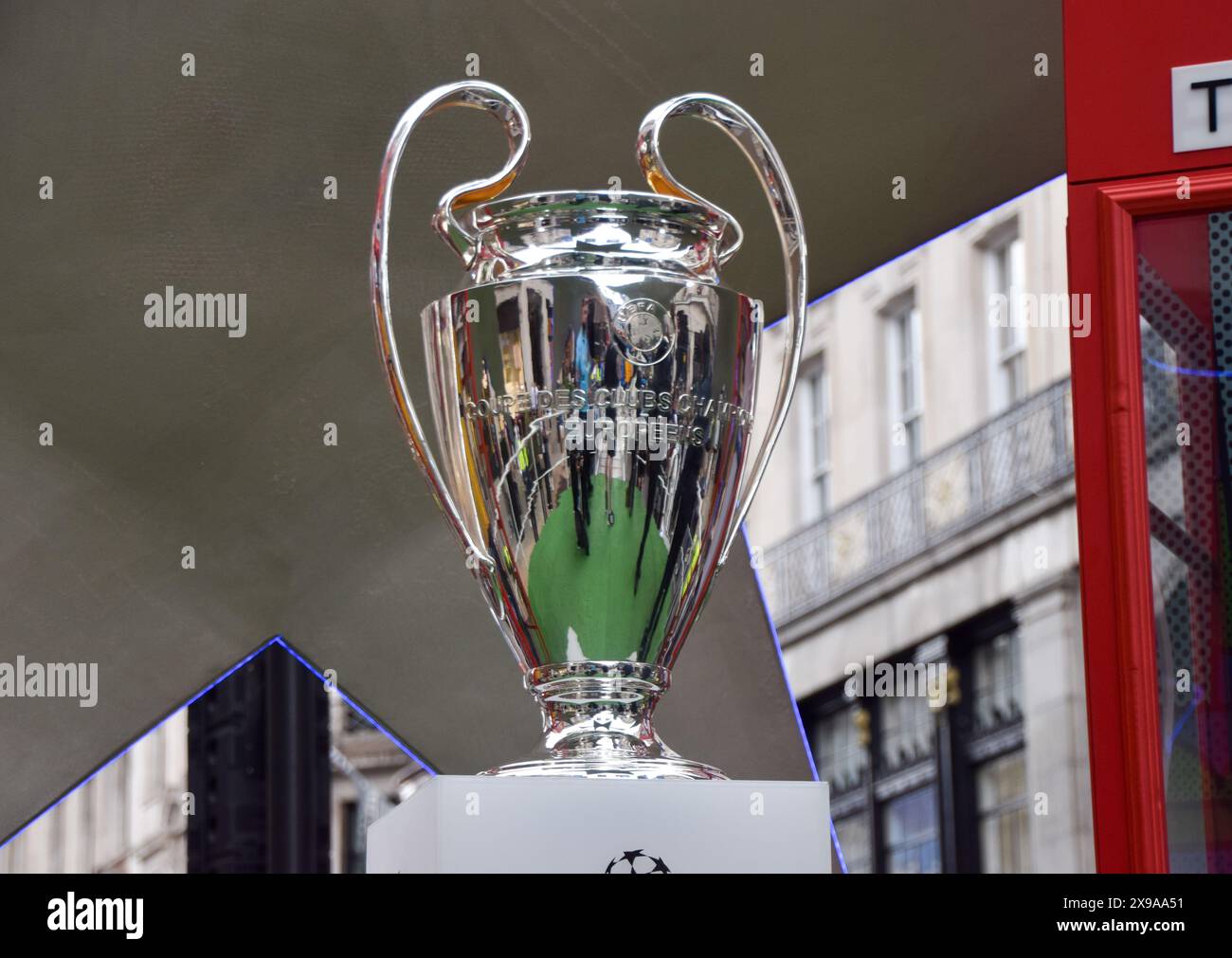 London, UK. 30th May 2024. The Champions League trophy is displayed in ...
