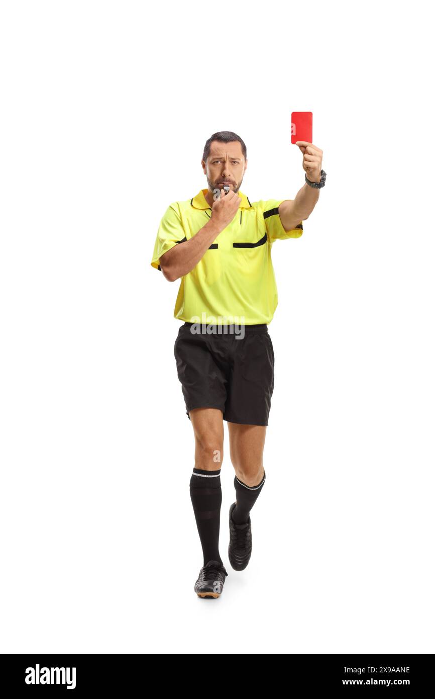 Football referee running with a red card and blowing a whistle isolated ...