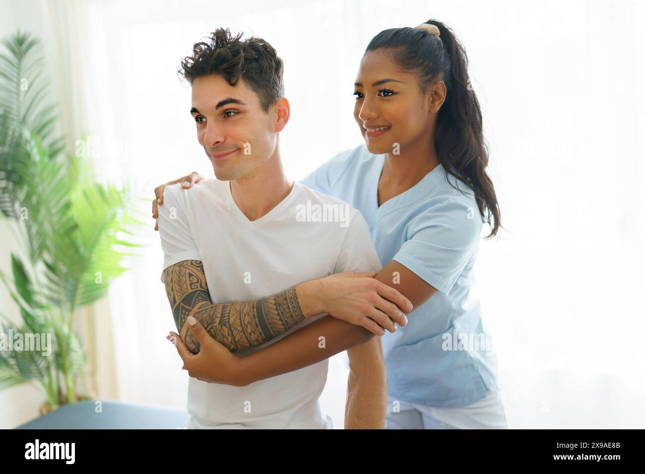 black rehabilitation woman physiotherapy at physio clinic with customer Stock Photo - Alamy