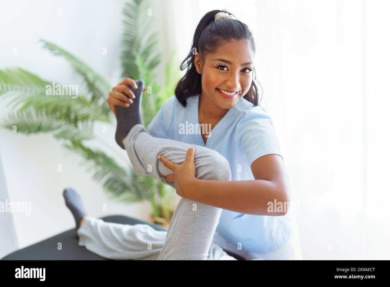black rehabilitation woman physiotherapy at physio clinic with customer Stock Photo - Alamy