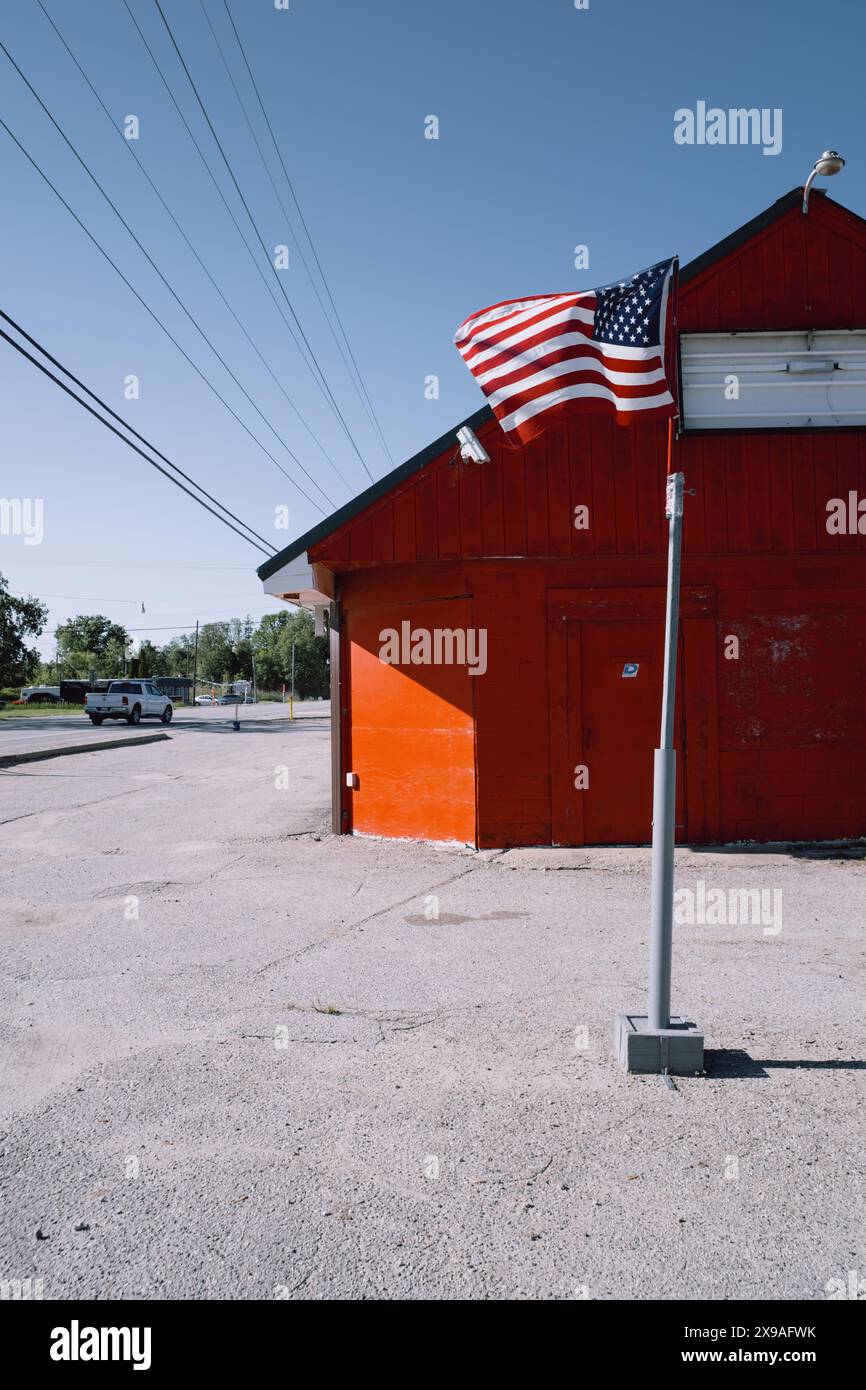 Red building and an American flag on a pole, in Lexington Heights ...