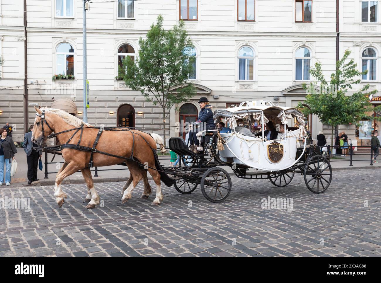 LVIV, UKRAINE - May. 18, 2024: A horse-drawn stagecoach is seen in the ...
