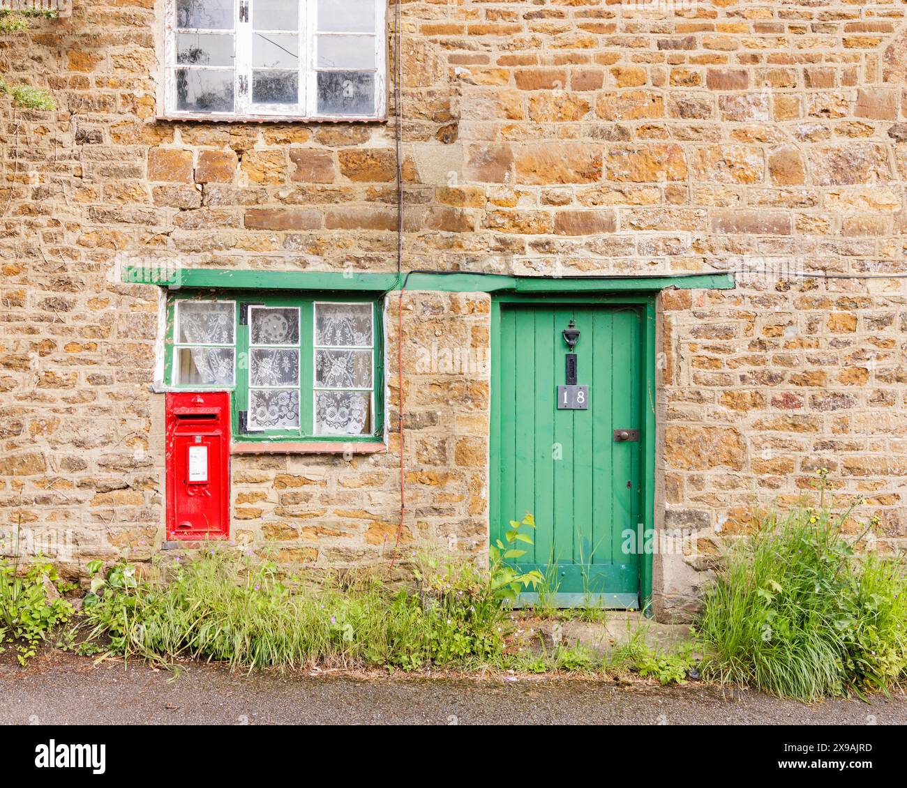 Charwelton, Northamptonshire, UK - May 2024: A built-in post box in the ...