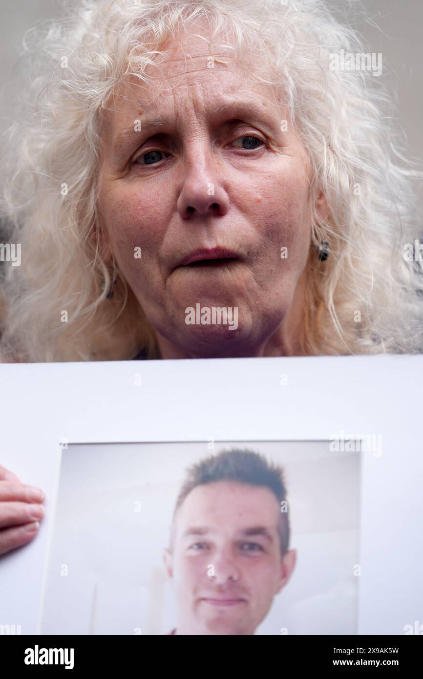 Yvonne Valentine, mother of Nicholas Billingham, holding a picture of ...