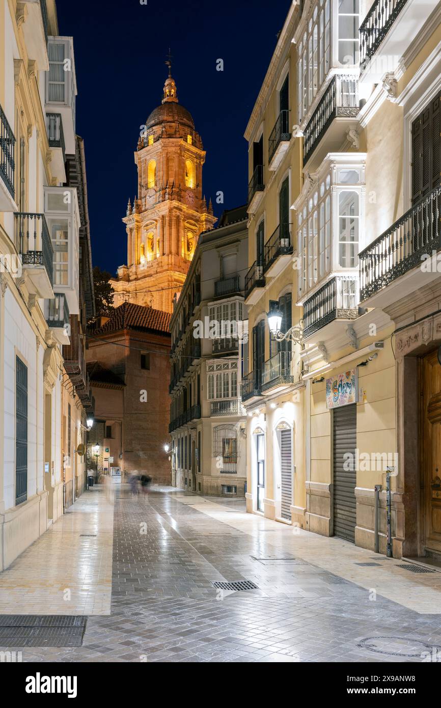 Scenic night view of a street in the old town with cathedral's bell ...