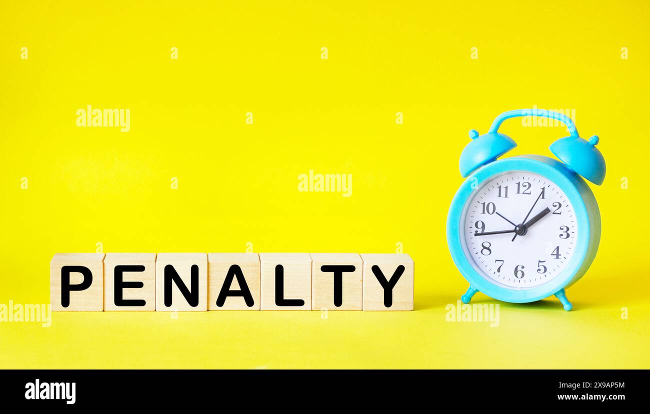 The word PENALTY made from building blocks on a yellow background with ...