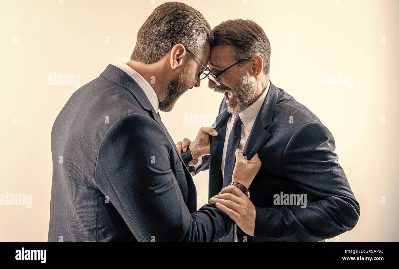 rival company threatening. businessmen threaten business men isolated ...