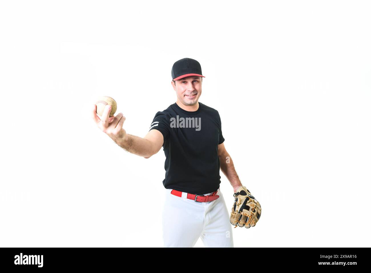 adult baseball player Studio shot over white Stock Photo - Alamy