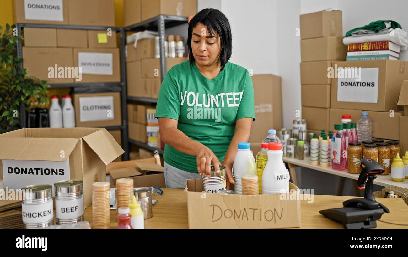 Woman organizing donations in charity hi-res stock photography and ...