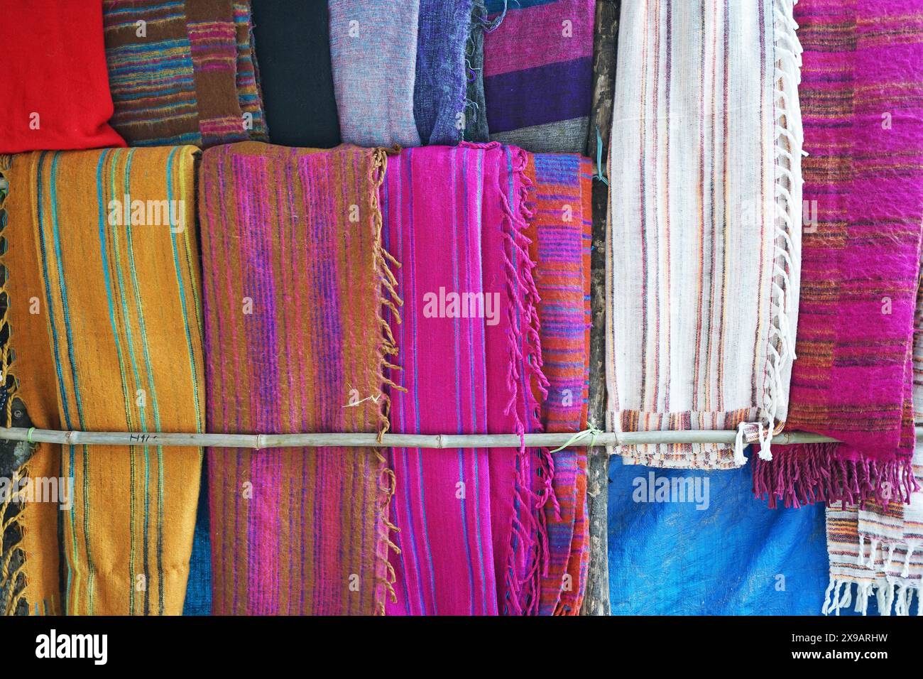 Colorful Fabric Kashmir scarf displayed on shelf stall Stock Photo - Alamy