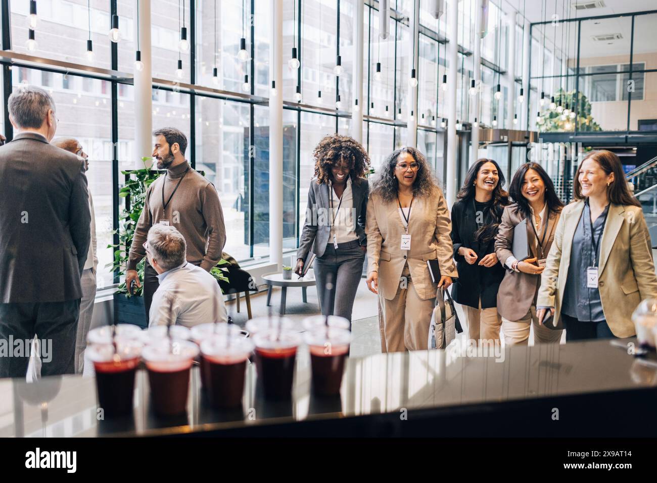 Group of male and female business professionals during networking event ...