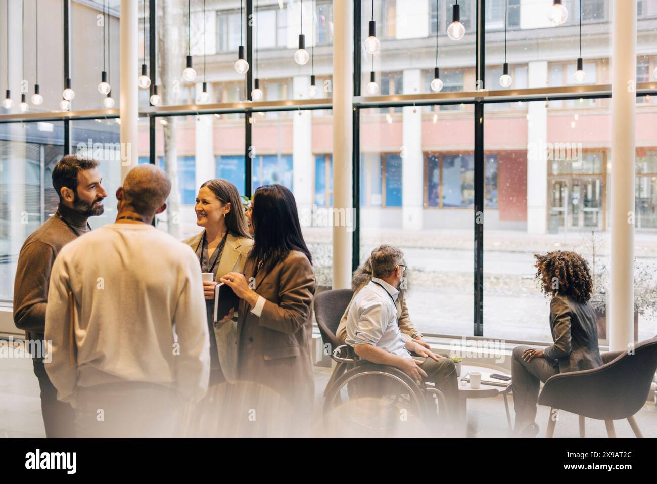 Male and female business delegates planning strategies during ...