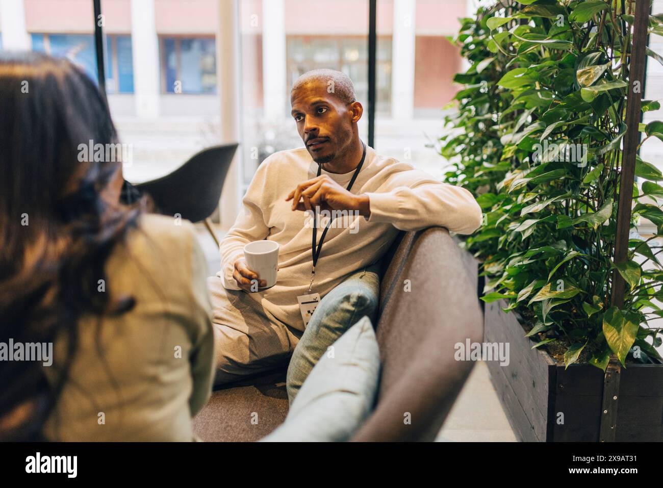 Female delegate explaining business hi-res stock photography and images ...