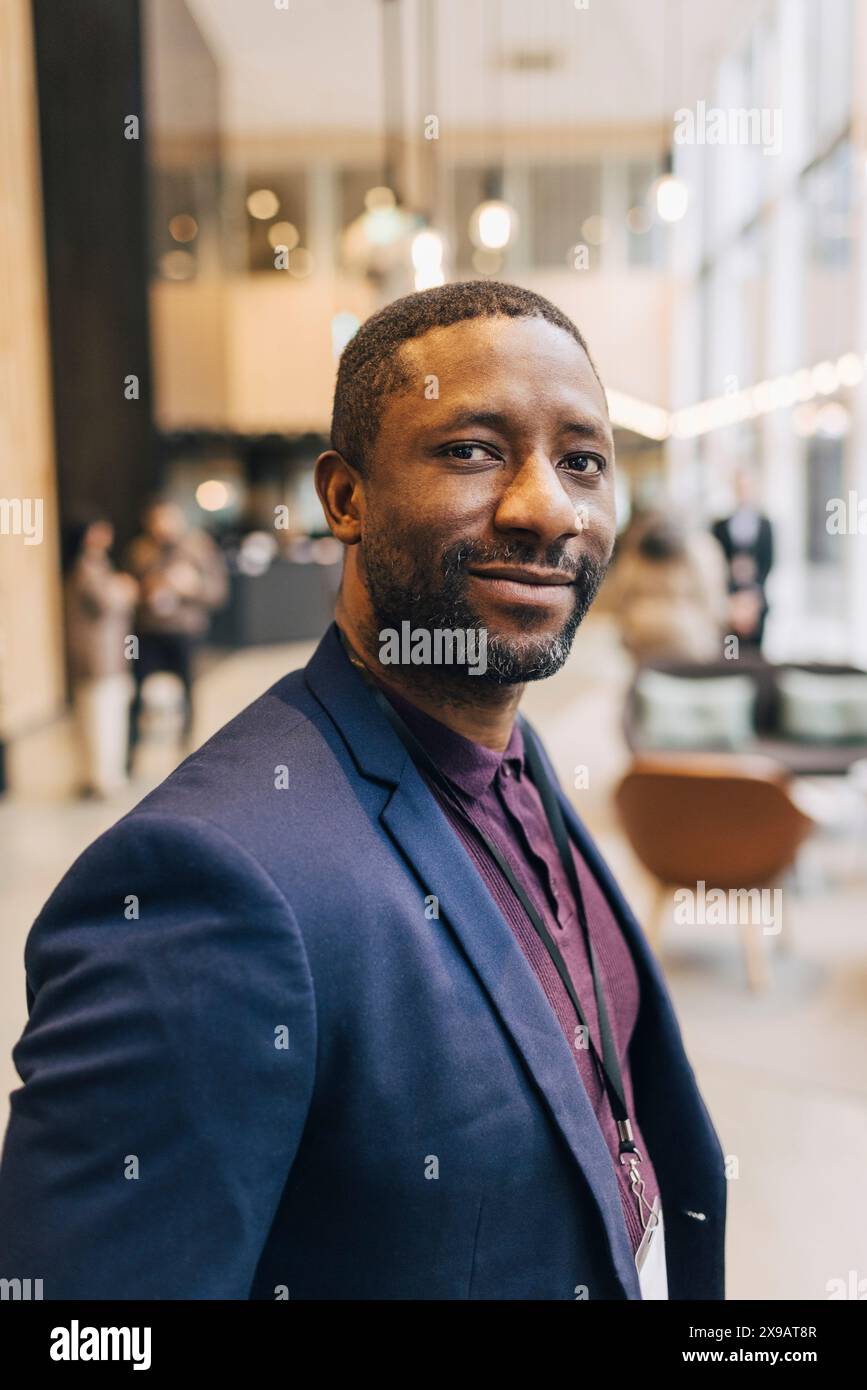 Portrait of confident male entrepreneur at convention center Stock ...