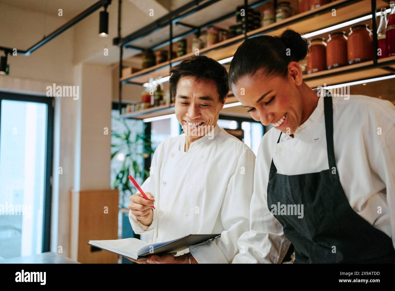 Group of cooks in the kitchen hi-res stock photography and images - Alamy