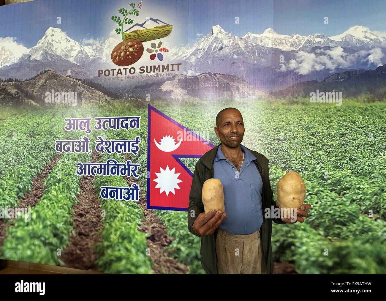 May 30, 2024: A man holds potatoes posing for a photo during the Potato ...