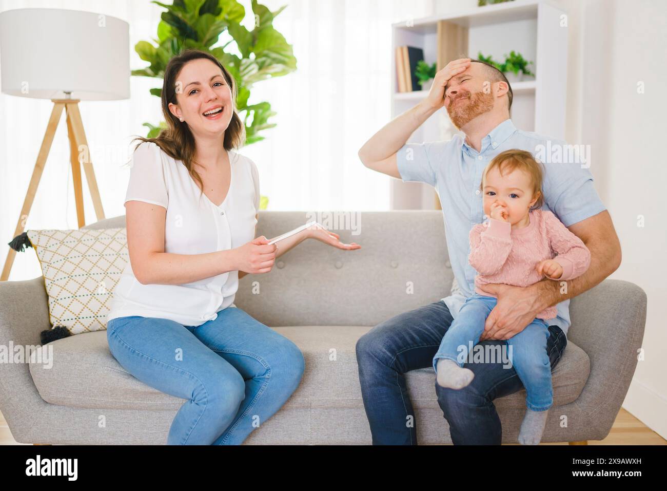 Sad Couple with pregnancy test at home interior with baby Stock Photo ...