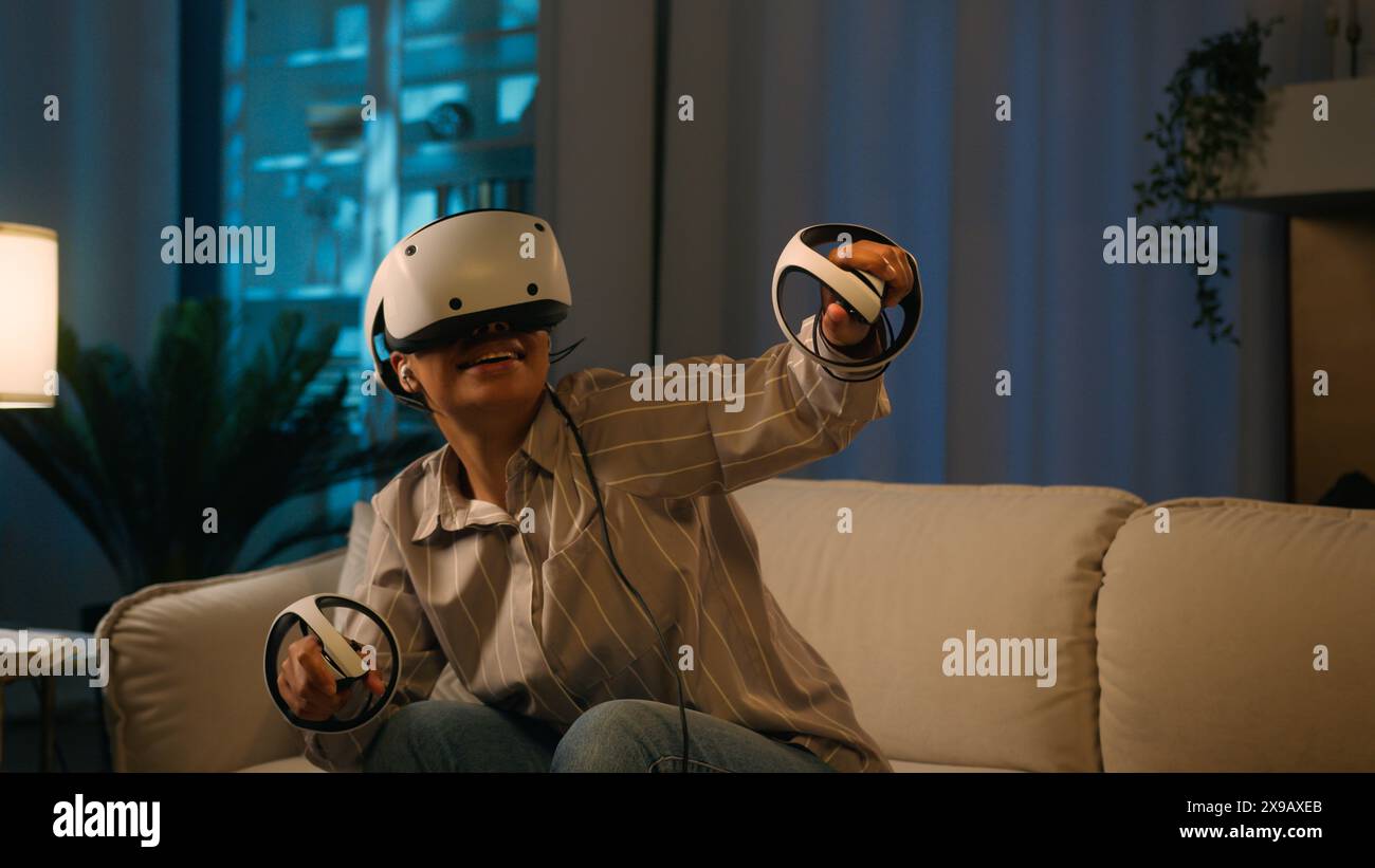 Woman play vr controllers hi-res stock photography and images - Alamy