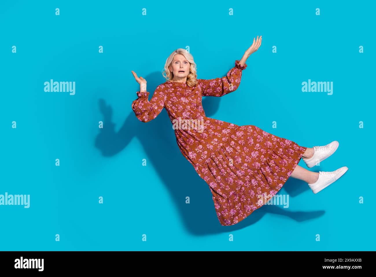 Full length photo of impressed afraid woman wear brown dress falling ...