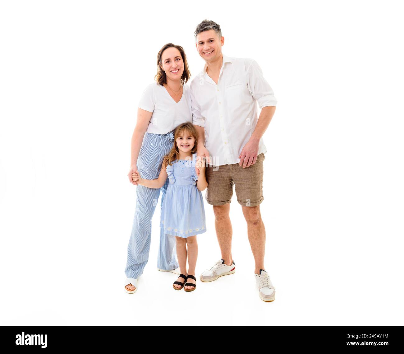 Parents and daughter having fun on studio portrait. Full body shot ...