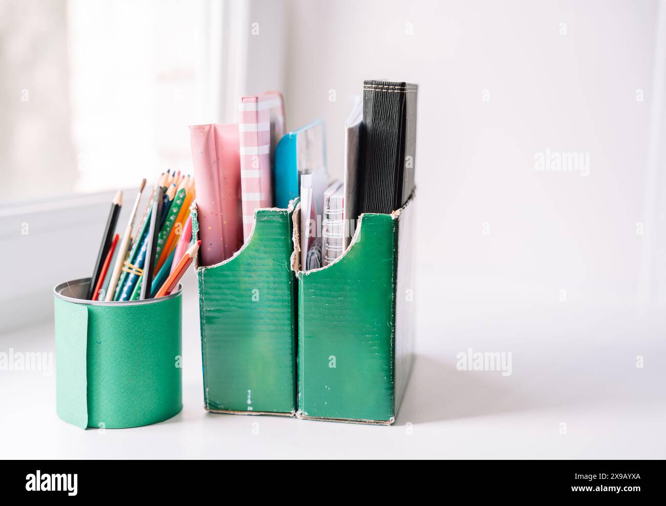 Recycling cans and cardboard boxes for stationery Stock Photo - Alamy