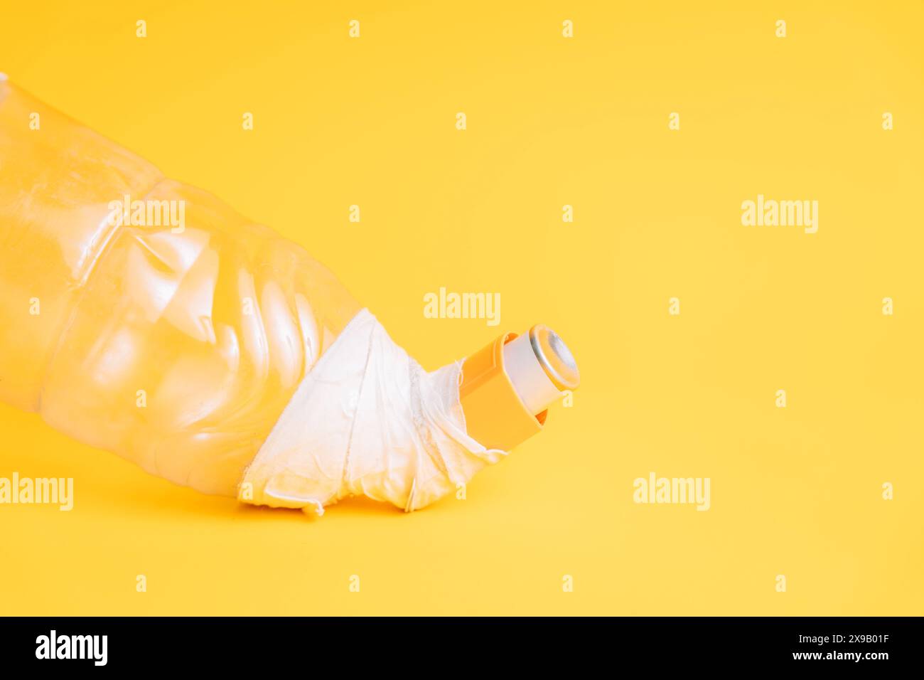 Recycling plastic inhaler bottles on yellow background Stock Photo - Alamy