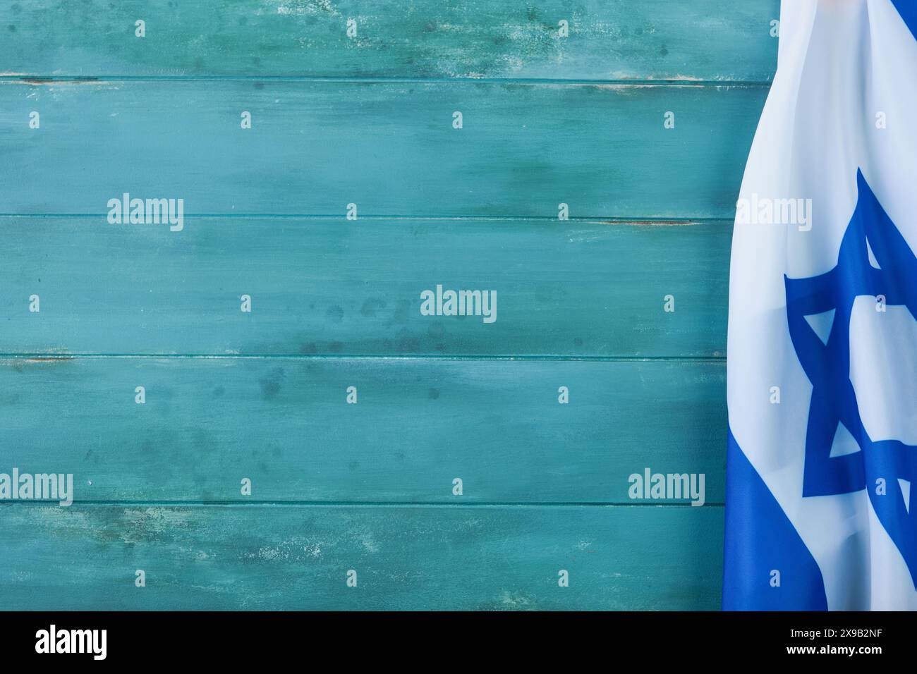 Shavuot jewish background. Ripe bouquet of wheat with blue ribbon with ...